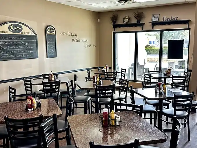Inside Goldie's, function trumps fashion with comfortable seating and menu boards that promise what matters most—great food without the Instagram theatrics.