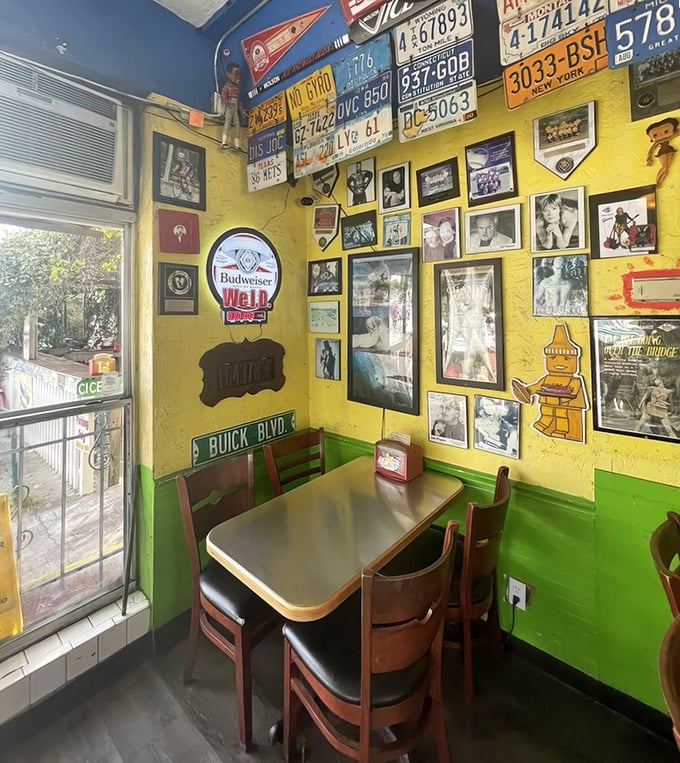 License plates from across America adorn sunny yellow walls, telling the story of pilgrims who've traveled far for hot dog nirvana.