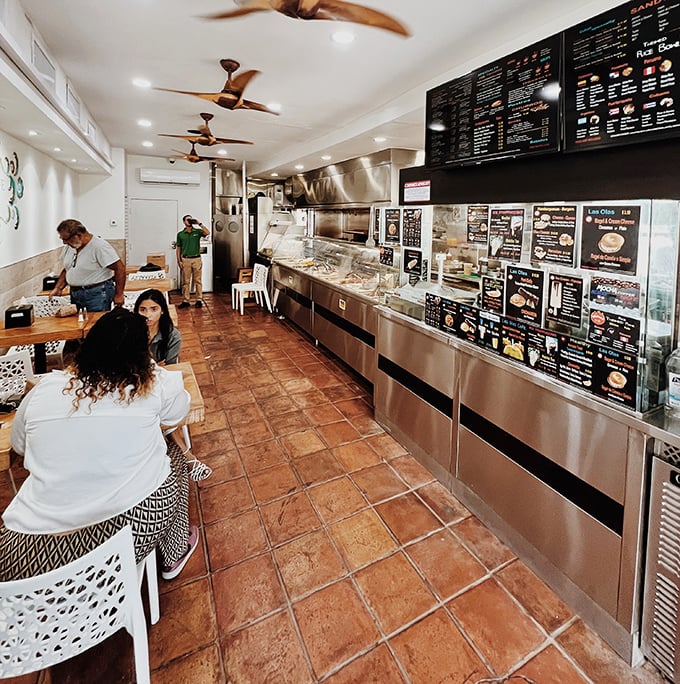 Inside, terra cotta floors and ceiling fans create the perfect no-frills backdrop for serious eating. This isn't Instagram food—it's the real deal.