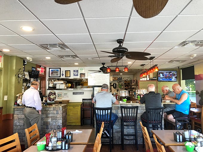 Counter culture at its finest—where regulars perch on stools, trading stories over coffee while ceiling fans lazily spin overhead.