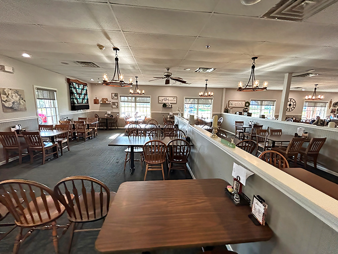 Simplicity reigns in this dining room where wooden chairs have cradled generations of satisfied diners. No Edison bulbs needed—just honest comfort and conversation.