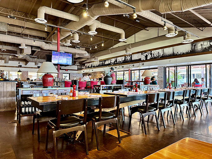 Industrial chic meets cozy comfort in this thoughtfully designed space where communal tables invite both conversation and serious eating.