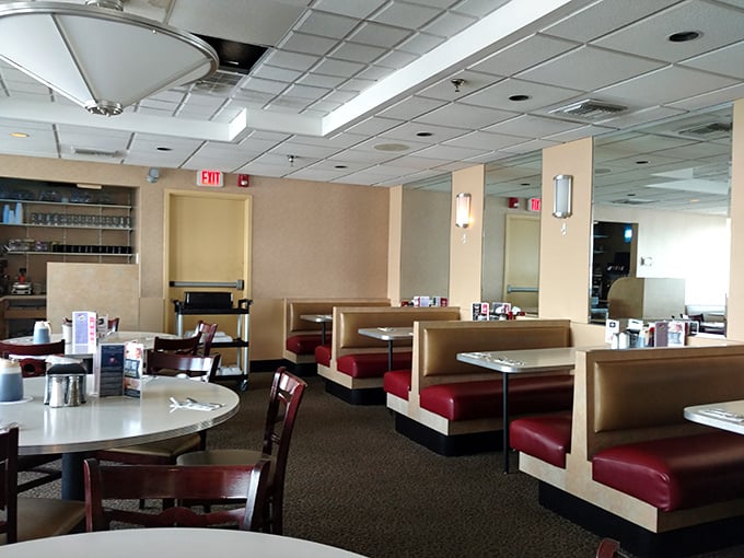 Classic diner booths upholstered in cherry-red vinyl invite you to slide in and stay awhile. This isn't trendy dining—it's timeless.
