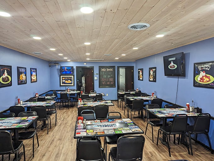 Blue walls and wooden ceilings create the perfect backdrop for comfort food conversations. This isn't Instagram-designed decor—it's authentically Tennessee.