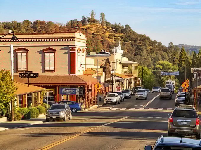 Golden hour bathes Mariposa's historic buildings in warm light, transforming the Gold Rush architecture into a photographer's dream. Savoury's Restaurant beckons hungry travelers.