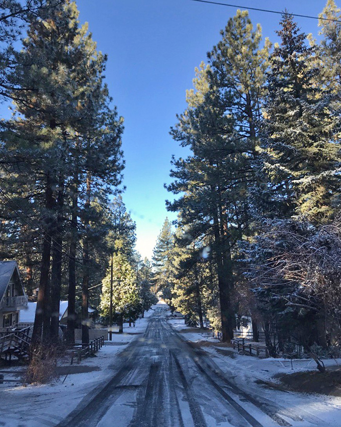 Winter transforms Big Bear's pine-lined streets into snowy corridors that make even the most dedicated beach-lover reconsider their life choices.