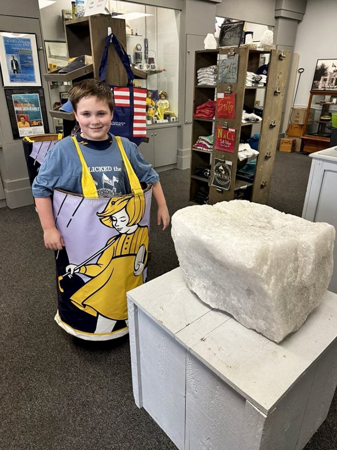 Young visitors get hands-on with history! This massive salt block display proves everything really is bigger in Texas, including mineral deposits.