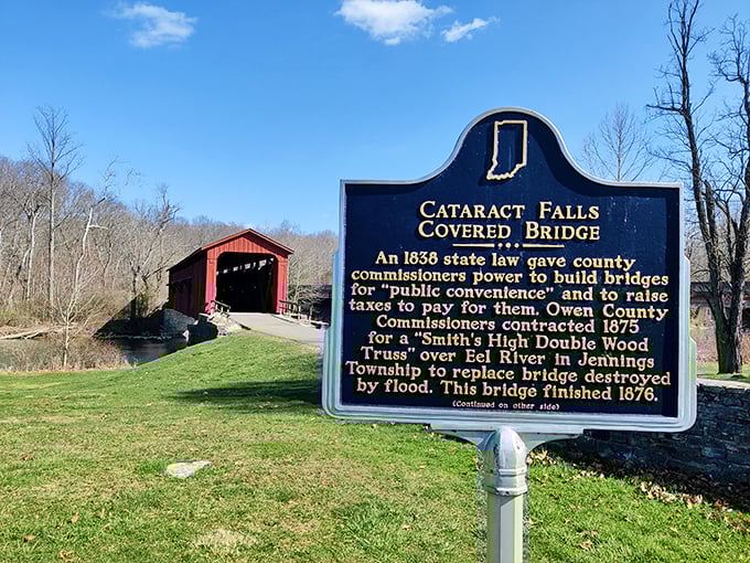 History cast in metal – this marker reveals the bridge's 1876 origins, when "public convenience" meant something built to last centuries.