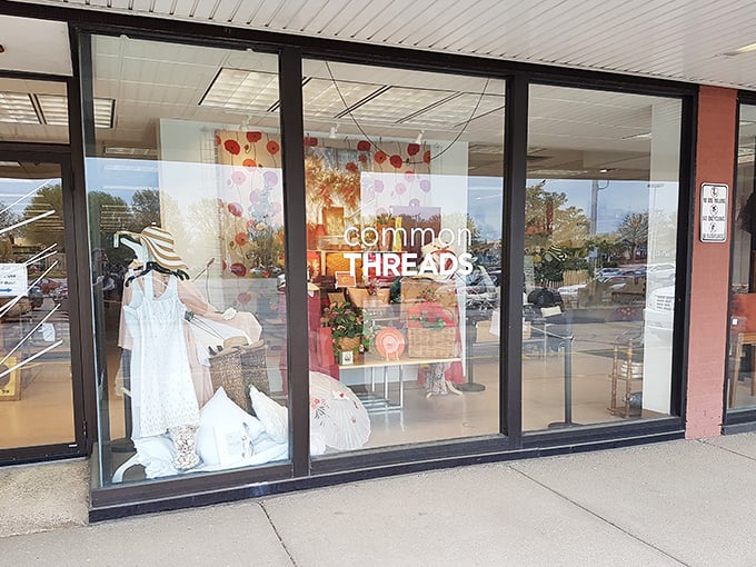 Window shopping takes on new meaning when the display itself is a masterclass in secondhand chic. That white dress is calling my name!