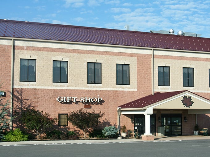 Brick, burgundy, and blue skies create the perfect backdrop for this shopping adventure. The maple leaf emblem hints at the natural craftsmanship found within.