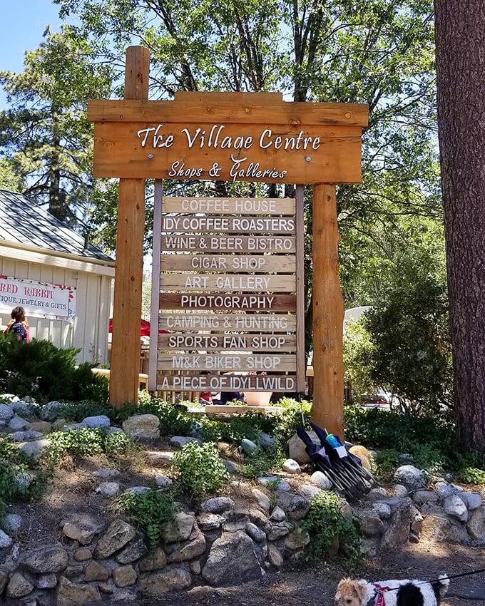 The Village Centre sign promises treasures within – like a wooden menu board for the soul offering everything from coffee to cigars.