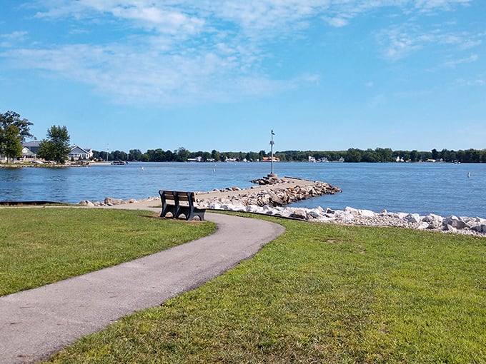 A bench with a view worth sitting for. This lakeside path offers the perfect spot to contemplate life's big questions—or just watch boats go by.