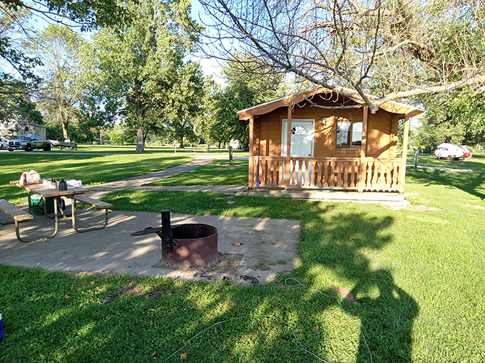 Rustic cabin living at its finest. This cozy lakeside retreat comes with its own fire pit—s'mores architects and ghost storytellers, your stage awaits!