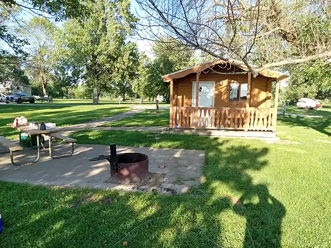 Rustic cabin living at its finest. This cozy lakeside retreat comes with its own fire pit—s'mores architects and ghost storytellers, your stage awaits!