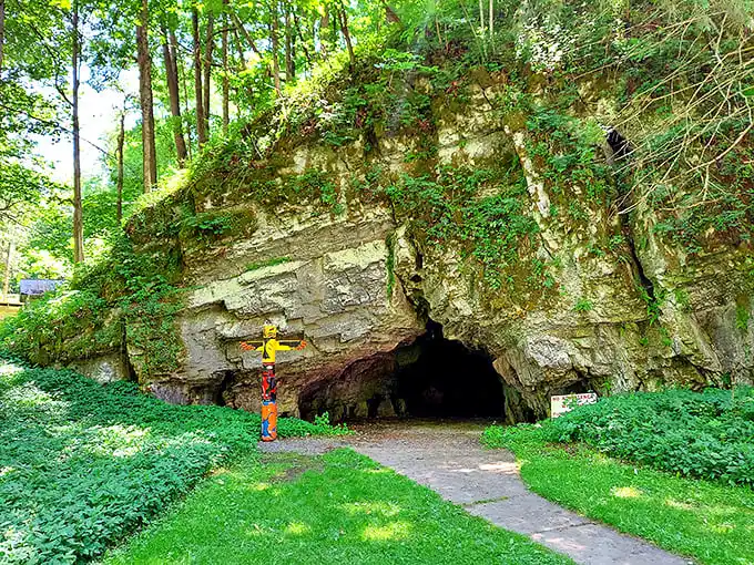 The cave's natural doorway frames an adventure that makes Alice's rabbit hole look like amateur hour.