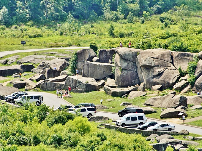 A bird's-eye view of Devil's Den shows visitors exploring this geological playground. From up here, people look like ants at a very ambitious picnic.
