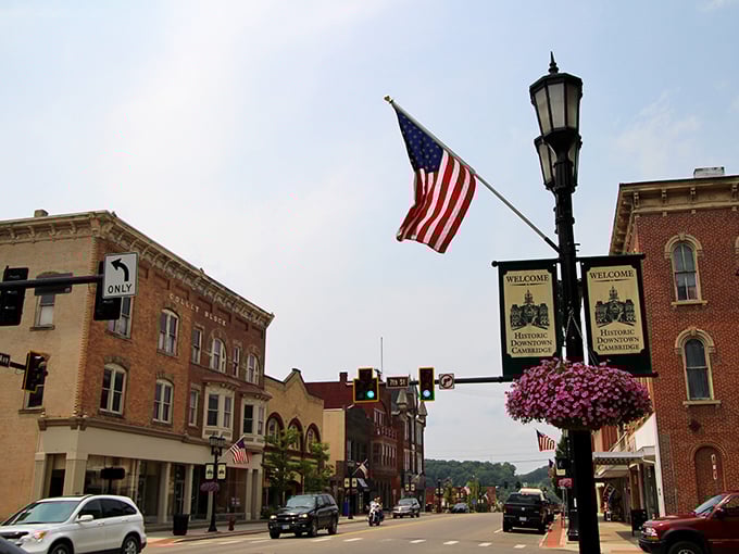 Downtown Cambridge greets visitors with American flags, hanging flower baskets, and a warm small-town welcome that feels like stepping into a Norman Rockwell painting.
