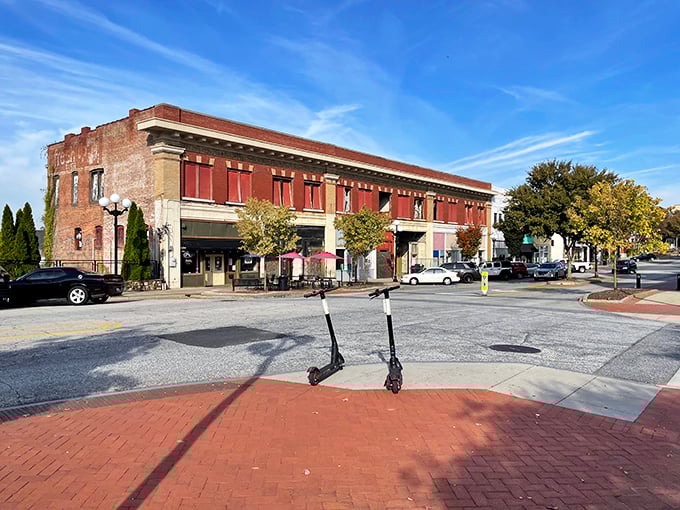Downtown Anderson's brick buildings aren't just pretty faces—they're home to locally-owned shops where proprietors actually remember your name. Even the scooters look relaxed here.