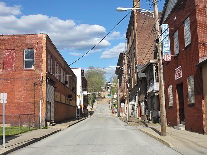 Streets that slope gently into tomorrow, lined with brick sentinels that have watched generations pass. Connellsville's modest thoroughfares offer walkability that luxury communities can only imitate.