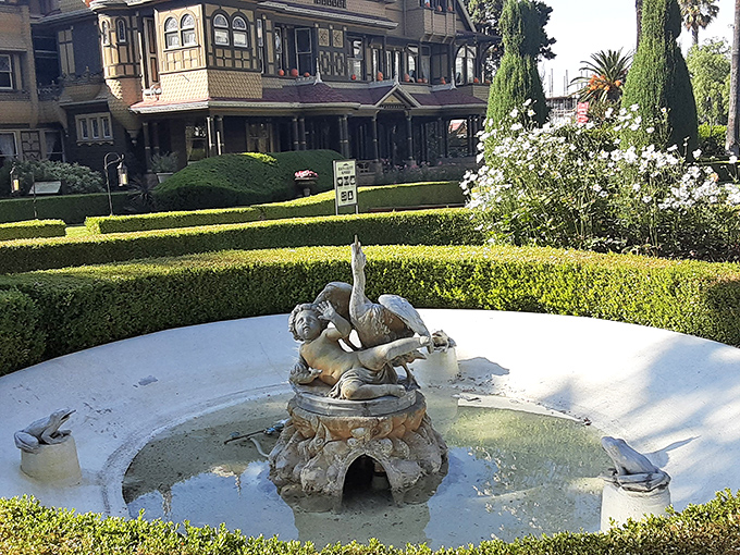 Even the fountain seems confused about which direction the house actually faces in this architectural wonderland.