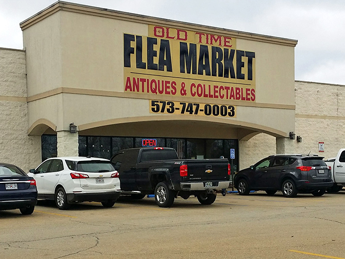 Rain or shine, the Old Time Flea Market beckons treasure hunters with its bold signage. The parking lot's always busy—a universal sign you've found somewhere special.