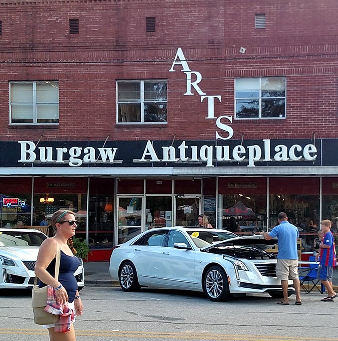 Where modern life pauses for a moment – the storefront draws in curious shoppers while the vertical "ARTS" sign serves as a downtown landmark. 