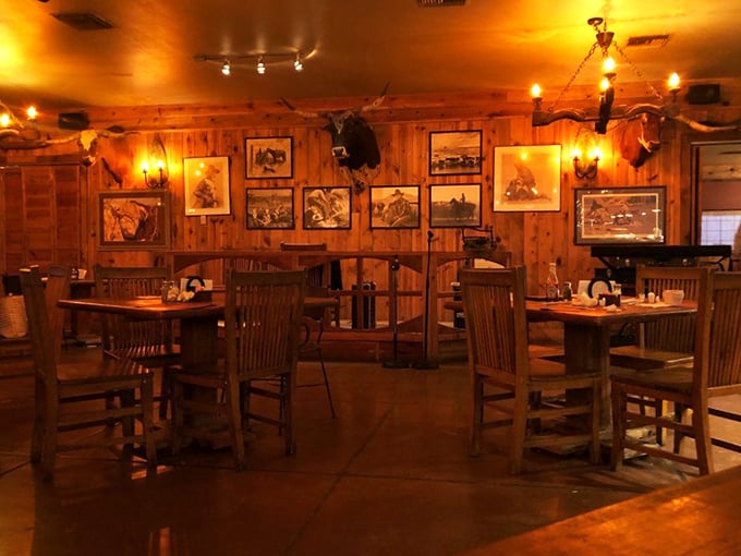 Step inside and you're transported to the Old West—wood-paneled walls adorned with cowboy art create the perfect backdrop for serious steak enjoyment.