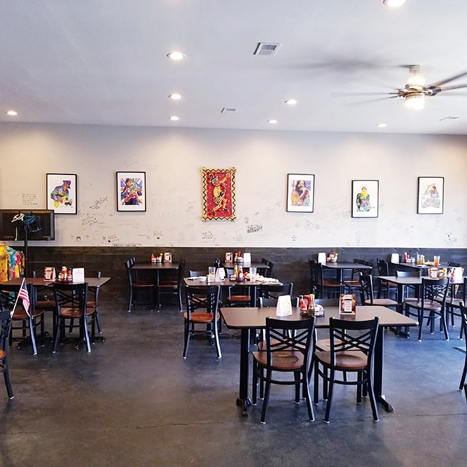 Simple tables, colorful artwork, and an atmosphere that says, "Come as you are." No pretension here—just the promise of comfort food done right.