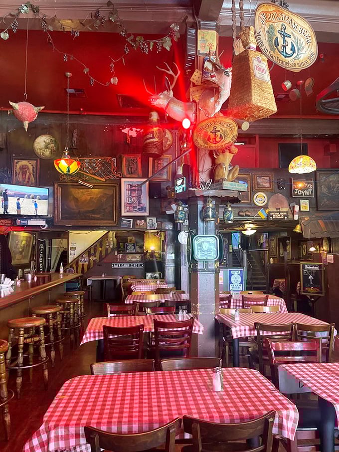 Step inside and find yourself in a museum of delicious chaos—where taxidermy, memorabilia, and checkered tablecloths create the perfect appetite-enhancing ambiance.