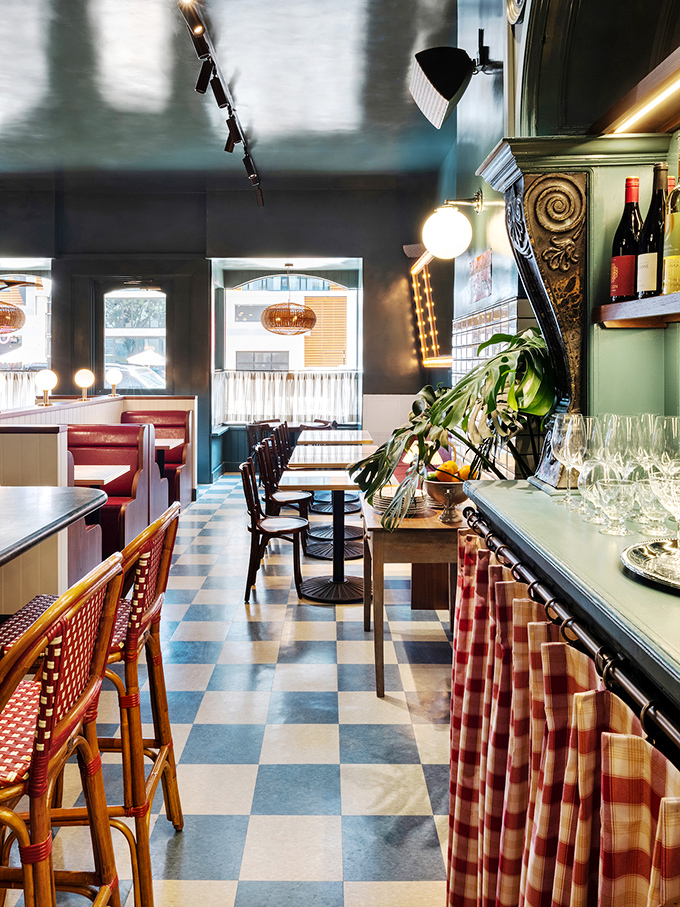 That blue and white checkered floor isn't just classic—it's practically the international signal for "good food happens here."