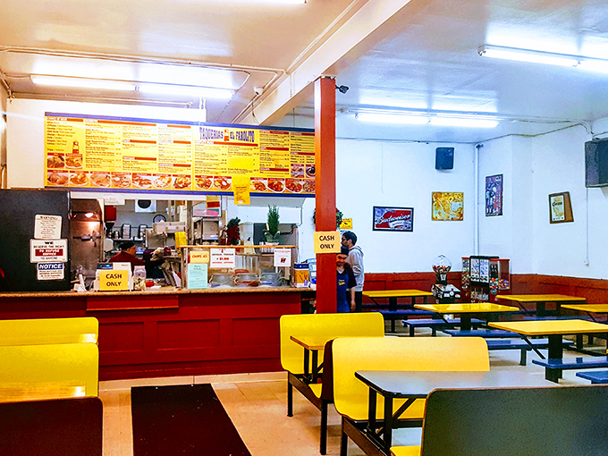 No-frills yellow benches and simple tables announce the priorities here: less time posing, more time eating. This is burrito business.