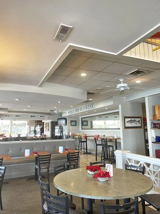 "SMILE THERE'S WINE" isn't just a sign—it's a life philosophy that perfectly captures the laid-back elegance of The Narrows' bright, airy dining room.