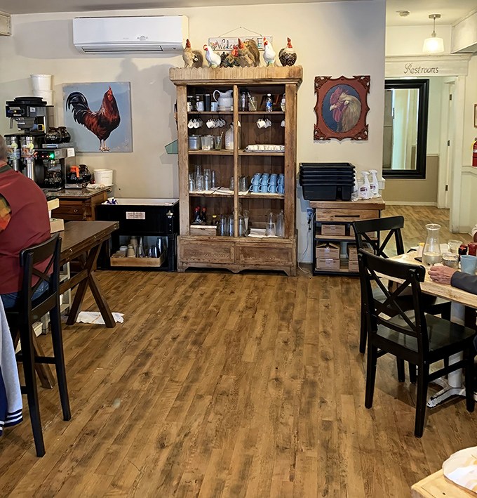 Rustic wooden floors, rooster-themed décor, and that cabinet of curiosities create the perfect backdrop for breakfast bliss. Farmhouse chic meets culinary excellence.