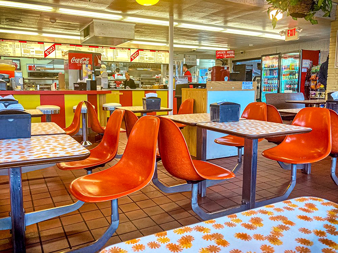 Time travel isn't just science fiction—it's what happens when you step into Speck's, where these orange molded chairs have witnessed decades of satisfied sighs.