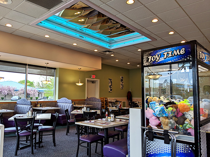 That blue skylight isn't just for show—it bathes the dining room in gentle light while the toy machine stands guard, promising prizes for well-behaved diners of all ages.