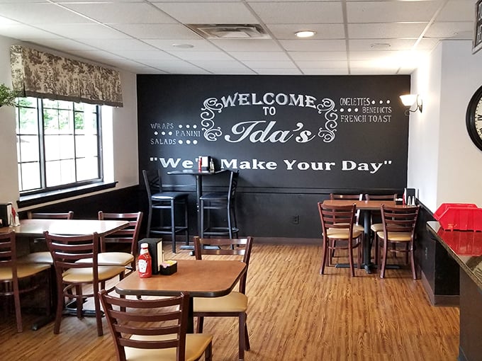 That chalkboard wall doesn't lie—Ida's will indeed make your day with its warm wooden floors and promise of comfort food ahead.