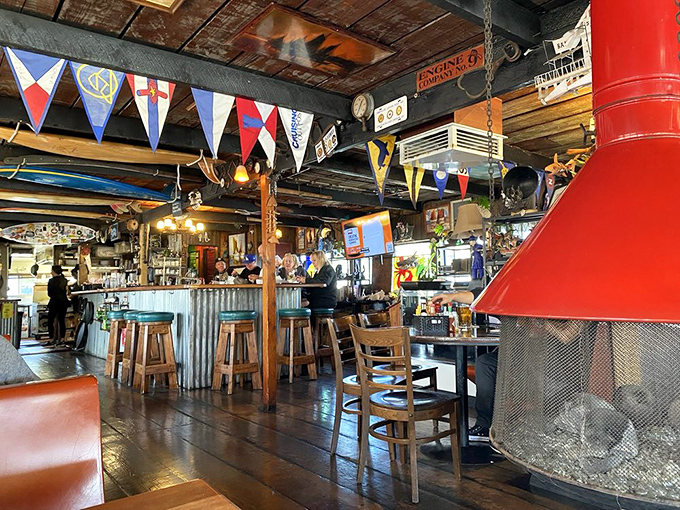 Step inside and you're transported to a mariner's dream—colorful flags, wooden beams, and that perfect "I've found somewhere special" feeling.