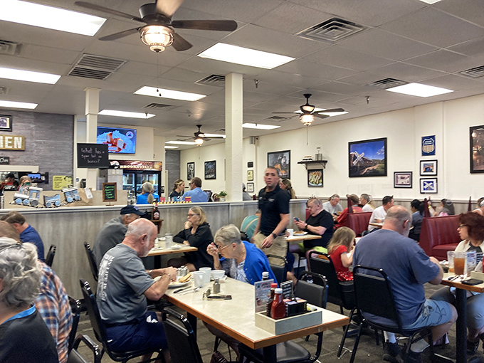 Inside, the breakfast symphony unfolds—ceiling fans whirring above conversations that matter only in small towns and diners that serve honest food.