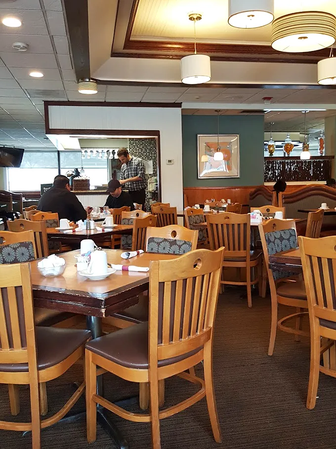 Warm wooden chairs and soft lighting create that "everybody knows your name" vibe—minus Norm and Cliff, but with better breakfast options.