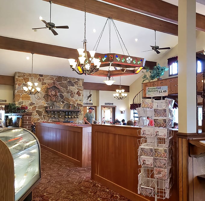 Warm wood tones, stone accents, and that distinctive lighting fixture—this isn't just retail, it's a temple to dairy craftsmanship where cheese dreams come true.