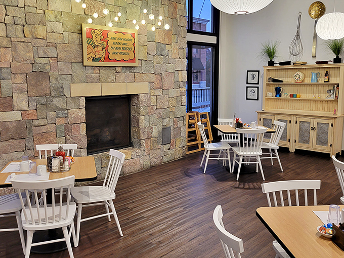 Where stone meets warmth—this fireplace isn't just architectural eye candy, it's the soul of the dining room.
