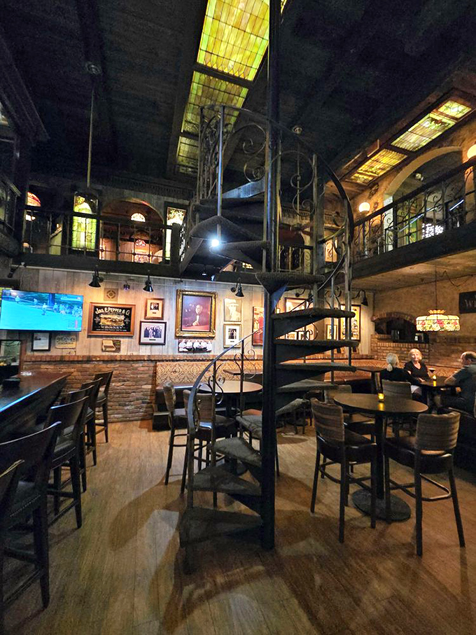 Stepping inside feels like entering a time capsule of elegance, with stained glass ceilings and a spiral staircase that's witnessed a century of special occasions.