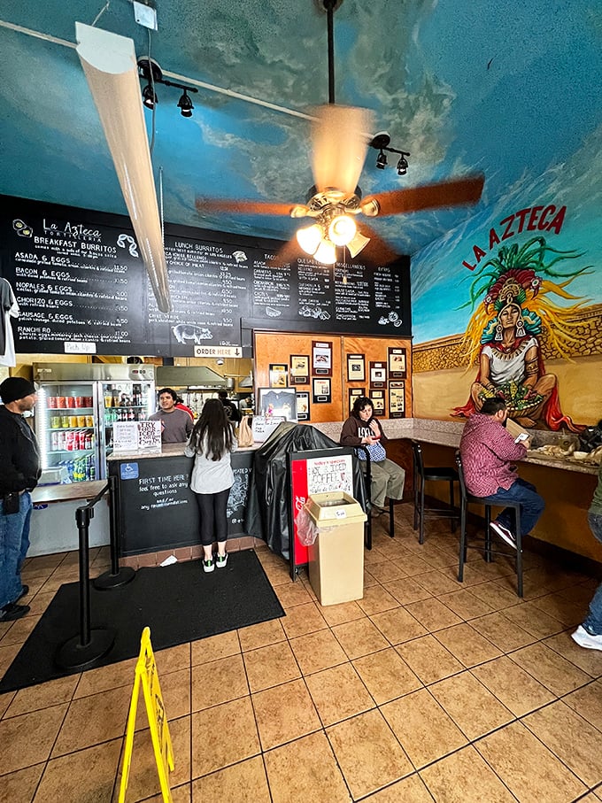 Inside, the cloud-painted ceiling and Aztec mural create an atmosphere that's both humble and magical—like a tortilla temple.