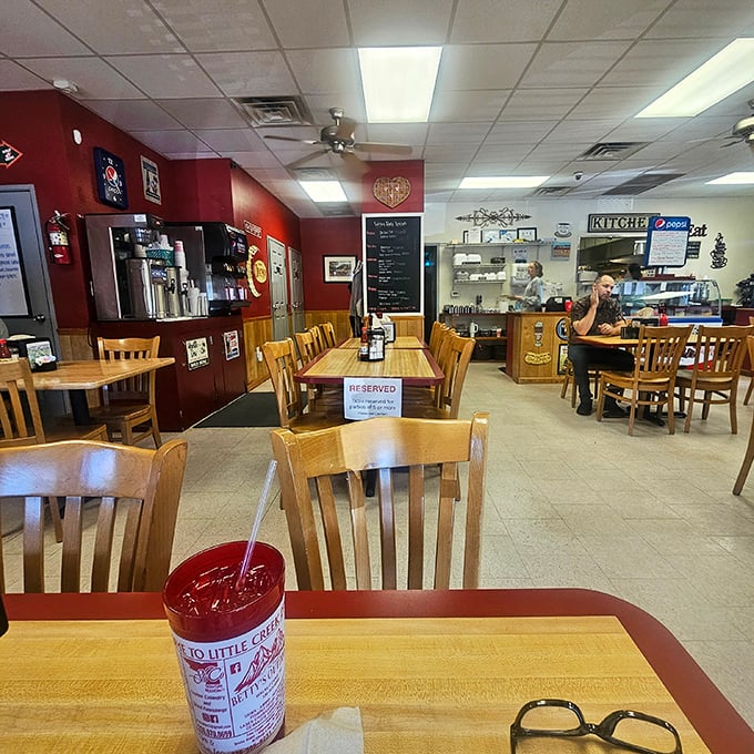 Red walls, wooden chairs, and ceiling tiles that have witnessed thousands of "mmms" and "aahs" – the stage is set for food that steals the show.