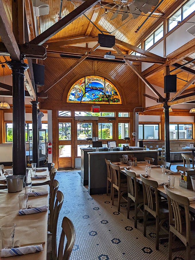 Soaring wooden ceilings, exposed beams, and that stunning stained glass window create a space that's both elegant and comfortably unpretentious.