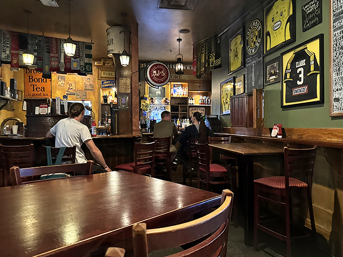 Step inside and you're transported across the Atlantic – dark wood, vintage memorabilia, and that unmistakable pub ambiance that whispers "stay awhile."