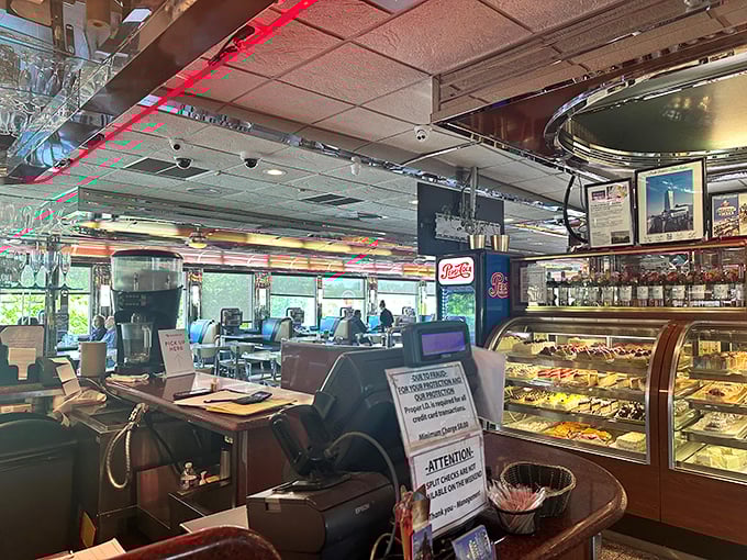 Where nostalgia meets appetite – the classic diner counter promises conversations with strangers who might become friends over coffee refills.