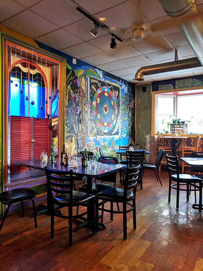 Step inside and you're greeted by a psychedelic seafood dreamscape. The vibrant murals and circular mandala designs turn a simple meal into a multisensory adventure.