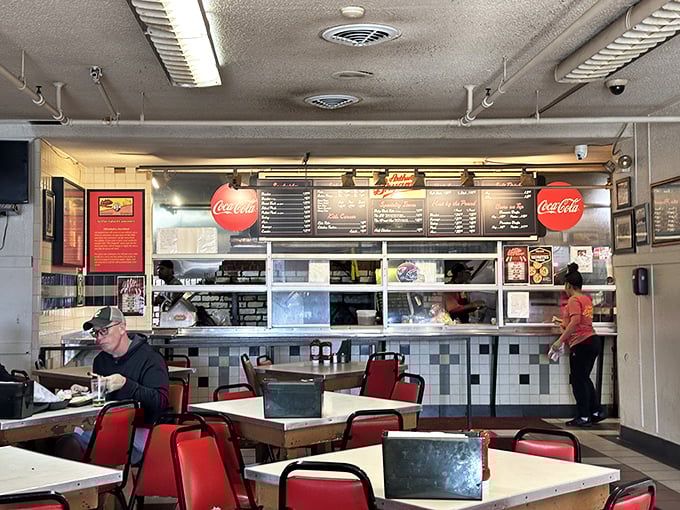 No-frills fluorescent lighting, simple tables, and a counter where culinary dreams come true. This isn't dining—it's a barbecue pilgrimage. 