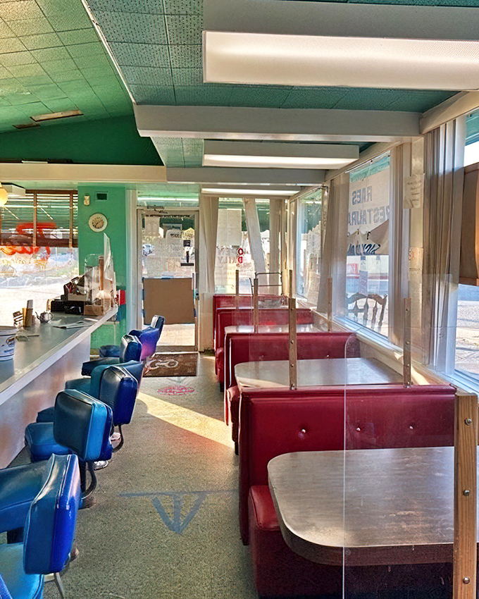 Step inside and suddenly you're in a mid-century dream—blue swivel stools, red vinyl booths, and the promise of comfort food that actually delivers on the comfort.